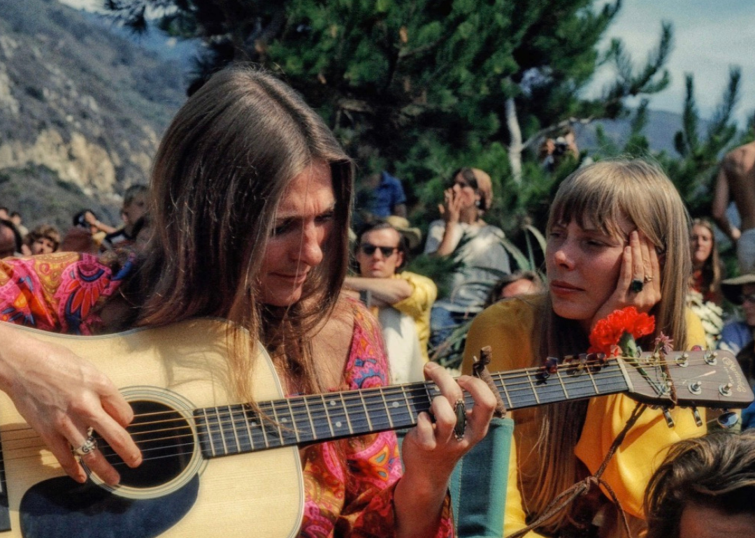50 Renowned Folk Songs Across Music History Stacker